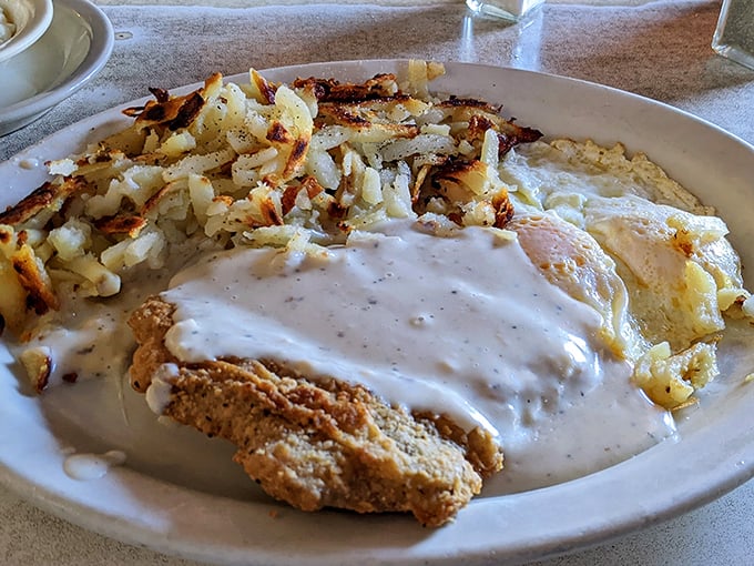 Behold the legendary chicken fried steak that's causing all the fuss – crispy perfection drowning in heavenly gravy.