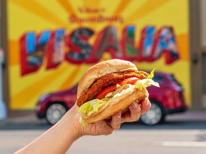 That golden-fried chicken sandwich isn't just photogenic – it's the kind of handheld masterpiece that makes you forget your table manners.