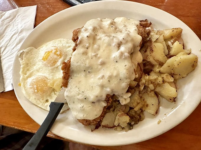 That's not just chicken fried steak—it's a blanket of country gravy protecting crispy perfection underneath.