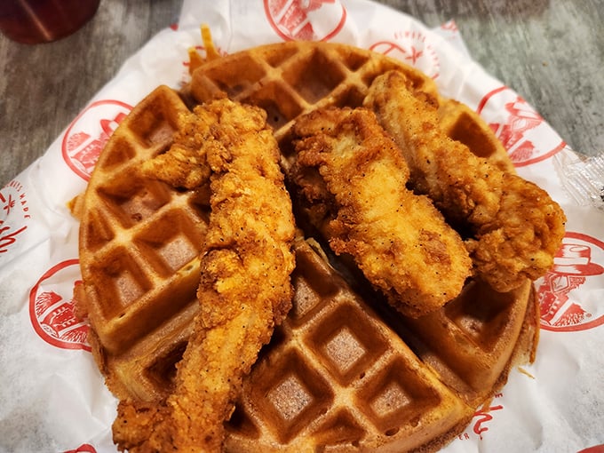 Golden-brown tenders perched atop a Belgian waffle—a sweet and savory marriage that proves some of the best relationships are built on opposites attracting.