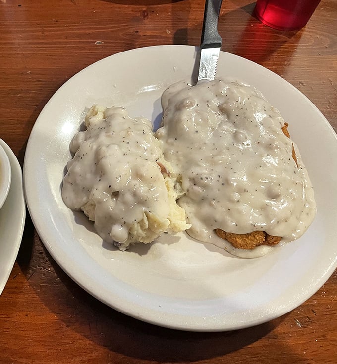 Behold the holy grail of comfort food! This chicken fried steak swimming in peppery gravy is what dreams—and stretchy pants—were made for.