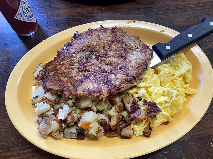 Behold the star attraction: chicken fried steak with eggs and home fries. This isn't diet food; it's happiness on a plate.