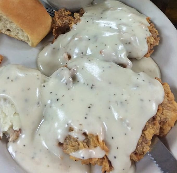 Behold the crown jewel: chicken fried steak smothered in peppery cream gravy. This isn't just food—it's edible therapy.