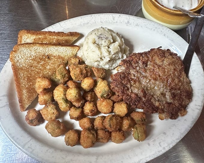 This isn't just chicken fried steak—it's a crispy, golden monument to comfort food, complete with mashed potatoes that didn't come from a box.