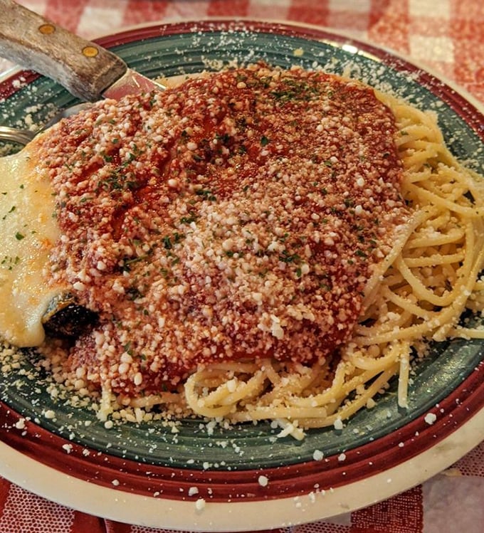 This chicken parmesan doesn't need a filter – just look at that golden crust and blanket of melted cheese. The kind of dish that makes conversation stop mid-sentence.
