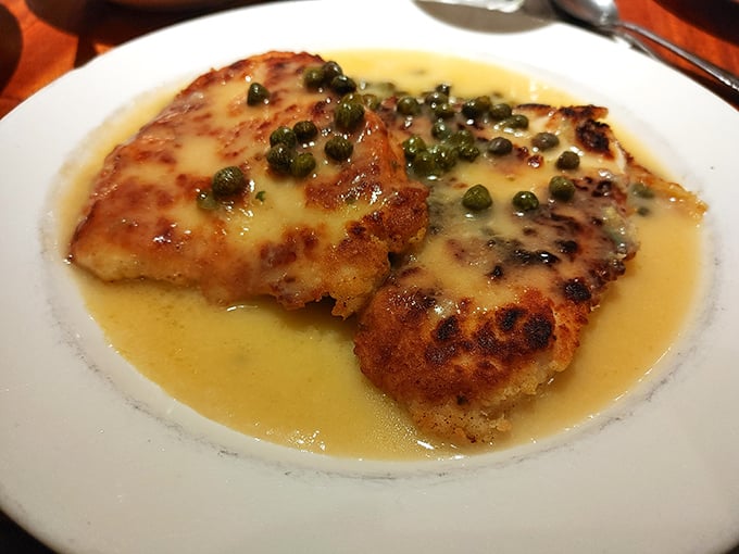 Behold the infamous chicken piccata—golden, lemony, and dotted with capers like edible emeralds floating in a buttery sea of perfection.