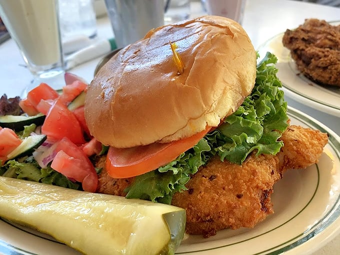 Golden-fried chicken, fresh veggies, and a perfectly toasted bun – this isn't just a sandwich, it's architecture you can eat.