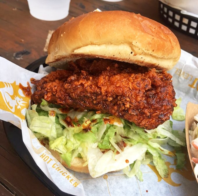 Behold the crown jewel: a hot chicken sandwich that makes other sandwiches question their life choices. That color isn't just spice—it's personality.