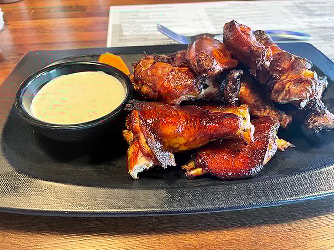 These wings aren't just smoked, they're transformed – glistening with caramelization and served with a sauce so good you'll contemplate drinking it straight.