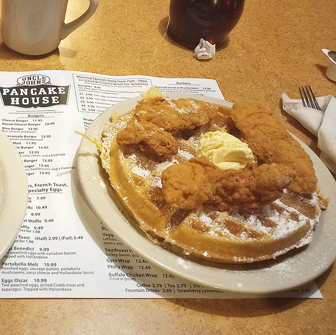 Behold the star attraction: golden-brown chicken perched atop a fluffy waffle throne, dusted with powdered sugar – a breakfast marriage made in Ohio heaven.