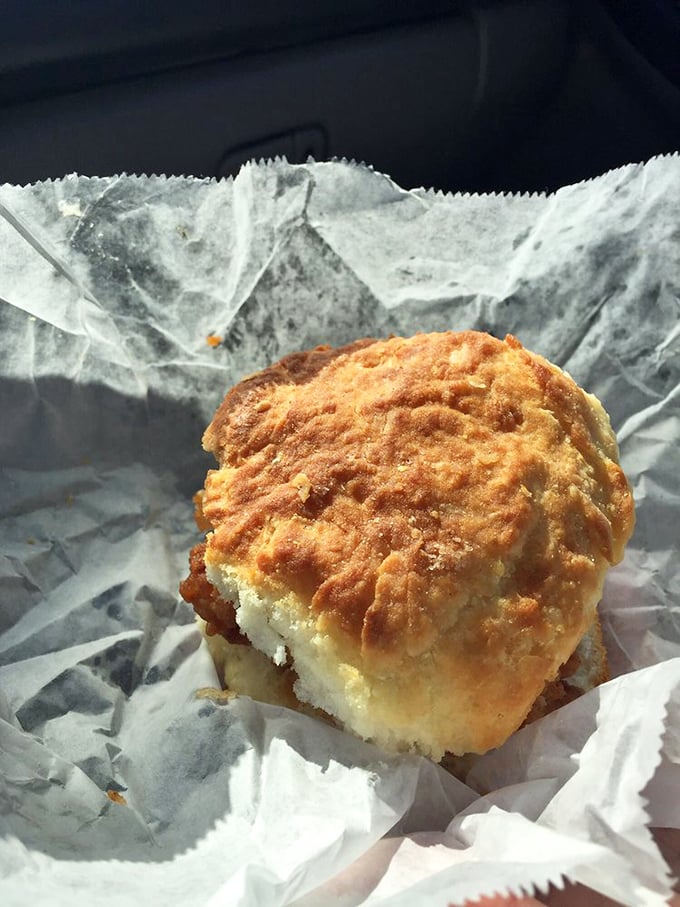 Behold the star of the show – a golden-brown chicken biscuit that makes you question whether you've ever truly experienced breakfast sandwich perfection before.