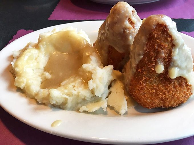 Chicken croquettes with mashed potatoes and gravy—the kind of comfort food that makes you want to call your mother and apologize for something.