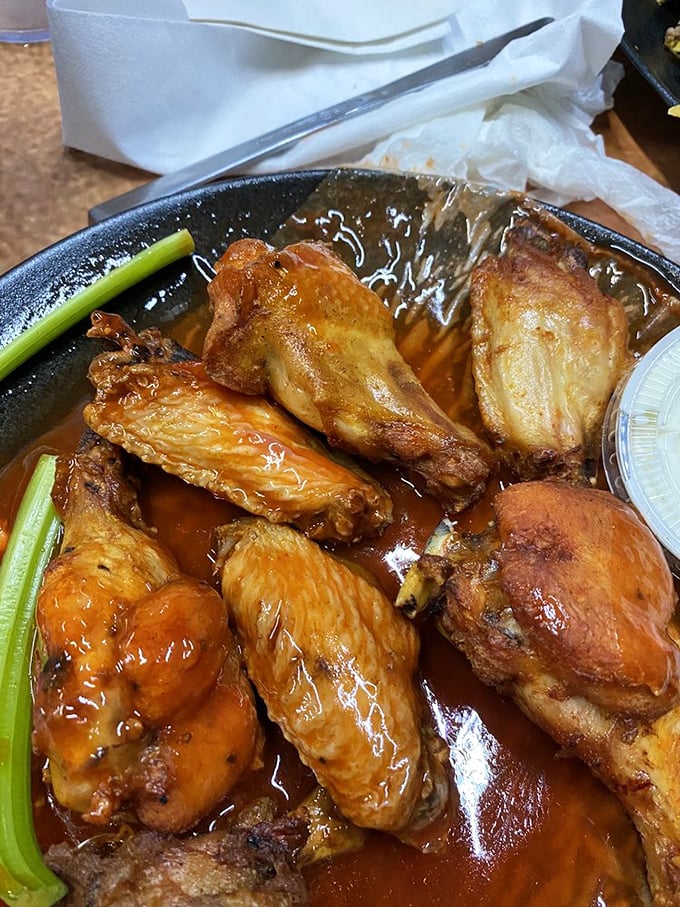 These aren't just wings; they're time machines to flavor country. Glistening with sauce and perfectly crisp, they're why locals brave tourist season.
