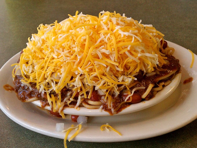 Behold the famous Cincinnati-style chili – that mountain of finely shredded cheese isn't compensating for anything, it's tradition!