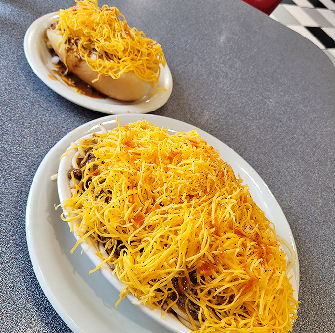 Mountains of finely shredded cheddar cascade over chili-smothered delights. In Cincinnati, cheese isn't a topping – it's practically a food group.