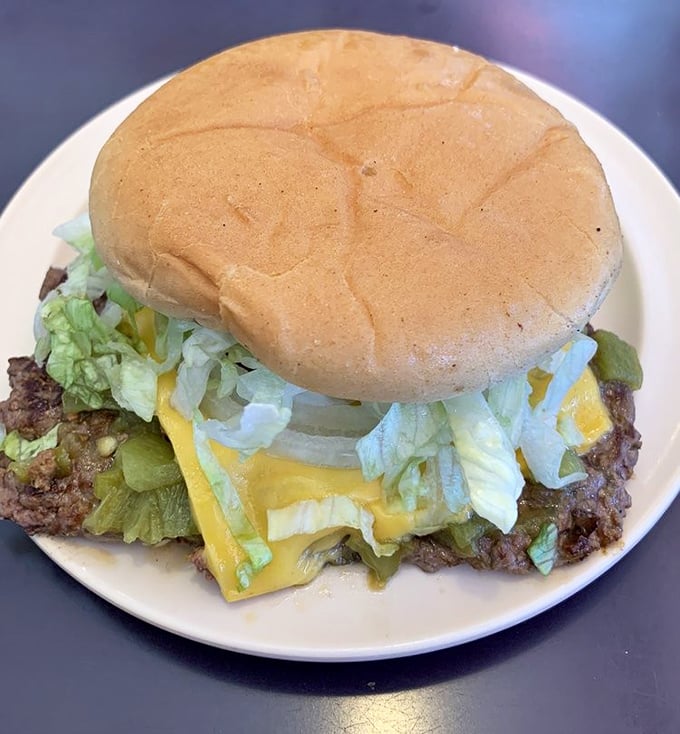 Behold the legendary green chile cheeseburger in all its glory—where beef, cheese, and chile create a holy trinity of flavor.