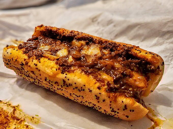 This isn't just a chili dog – it's a masterclass in balance, where savory meat sauce and melted cheese transform a simple hot dog into comfort food royalty.