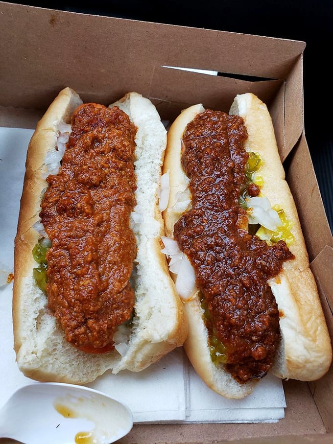 These chili dogs aren't just topped—they're smothered in meaty magnificence. The kind of meal that requires both napkins and a moment of silent appreciation.