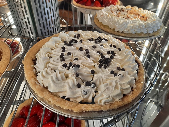 This chocolate cream pie isn't just dessert—it's a fluffy cloud of happiness topped with chocolate chips that whisper, "Diet? What diet?"
