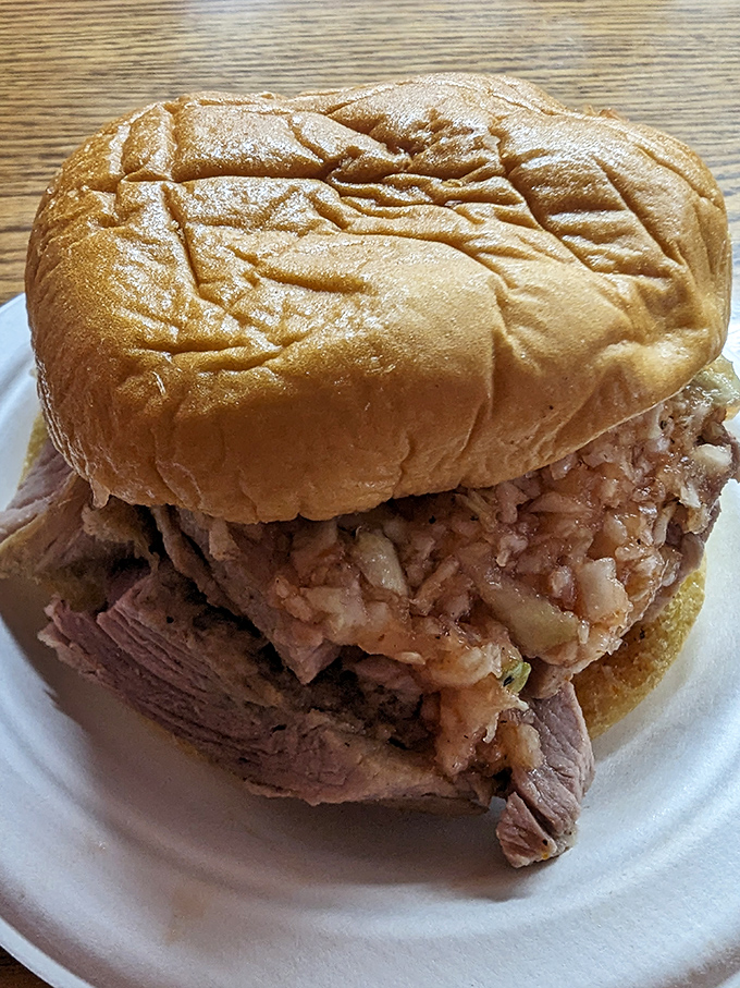 The star of the show in all its glory—tender chopped pork piled high on a soft bun. This isn't just a sandwich; it's North Carolina history you can taste.