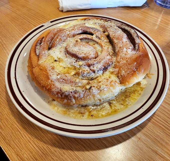 This cinnamon roll isn't just breakfast, it's an event—a spiral of buttery dough and cinnamon sugar that makes moderation seem highly overrated.