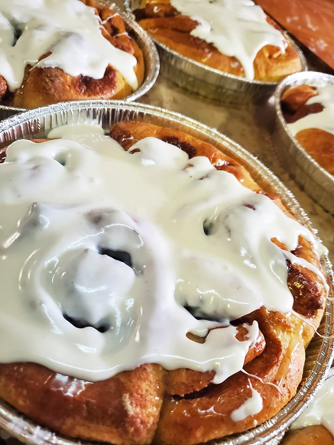 Behold the holy grail of breakfast indulgence – a cinnamon roll so perfectly iced it should require a permission slip from your doctor.