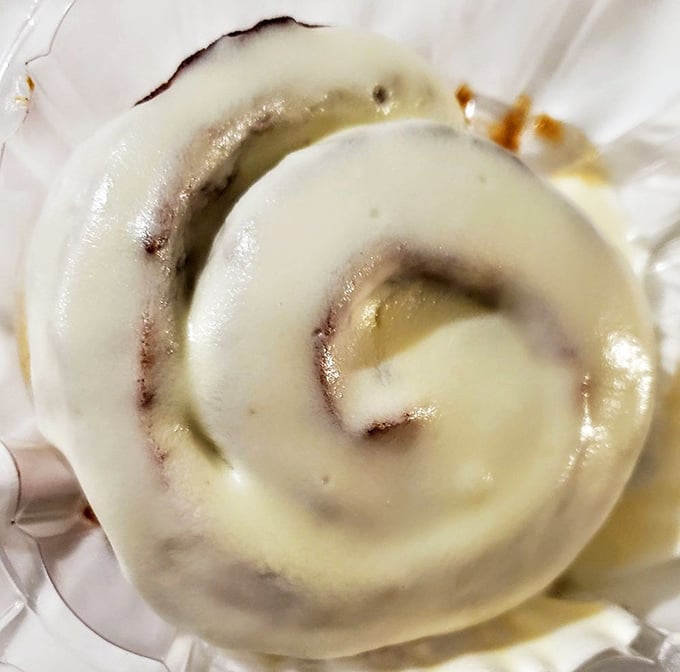 This cinnamon roll isn't just breakfast—it's an edible hug with a perfect spiral of cinnamon and cream cheese frosting.