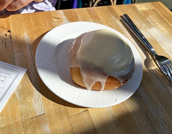 Behold the holy grail of breakfast indulgence—a cinnamon roll so perfectly glazed it could make a pastry chef weep with joy.