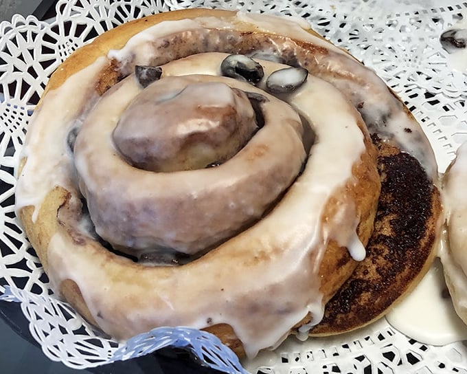This cinnamon roll isn't just baked—it's engineered for maximum pleasure. Pillowy dough, melted raisins, and icing that doesn't know when to quit.