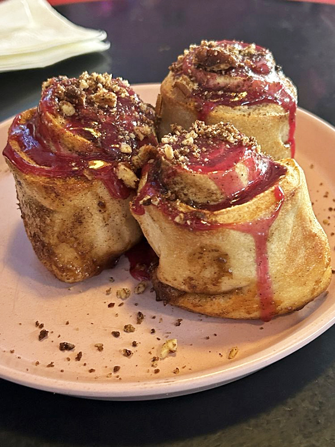 These aren't just cinnamon rolls—they're spiral-shaped masterpieces of buttery dough, cinnamon filling, and berry glaze that might just change your life.