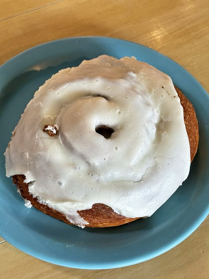 This cinnamon roll isn't just breakfast—it's an event. The icing-to-pastry ratio would make even the most disciplined dieter weak at the knees.