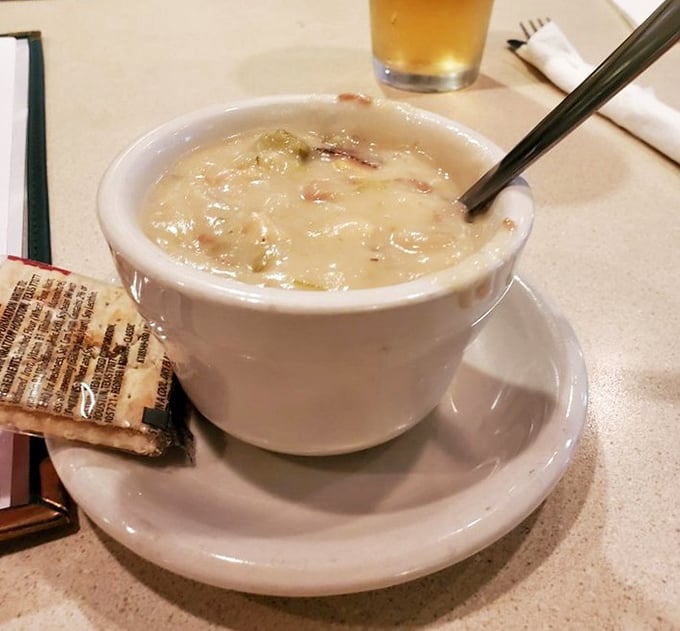 The legendary clam chowder arrives like a creamy ocean in a cup, with tender clams playing hide and seek.