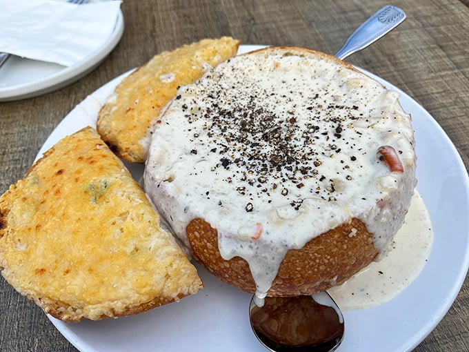 The star of the show arrives in its sourdough throne. This isn't just chowder—it's a creamy revelation that demands a moment of silence.