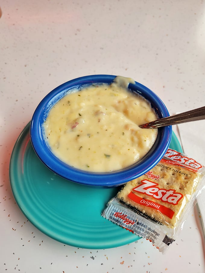 The clam chowder arrives like a creamy revelation, with those little packets of crackers standing by like eager supporting actors.