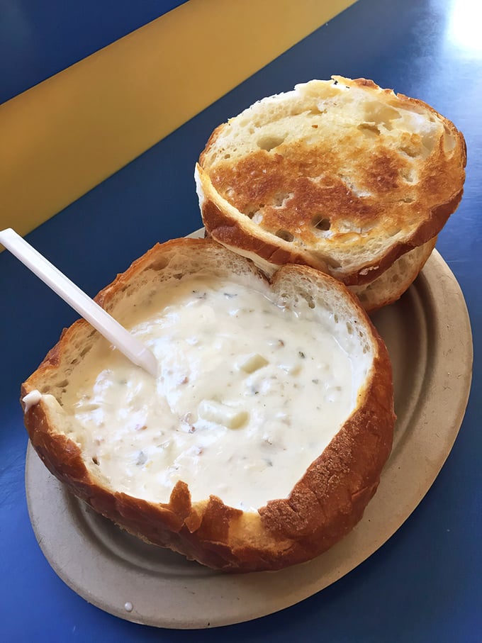 Behold the holy grail of clam chowder, served in its natural habitat – a hollowed-out sourdough bread bowl that becomes increasingly delicious as it soaks up the creamy treasure.