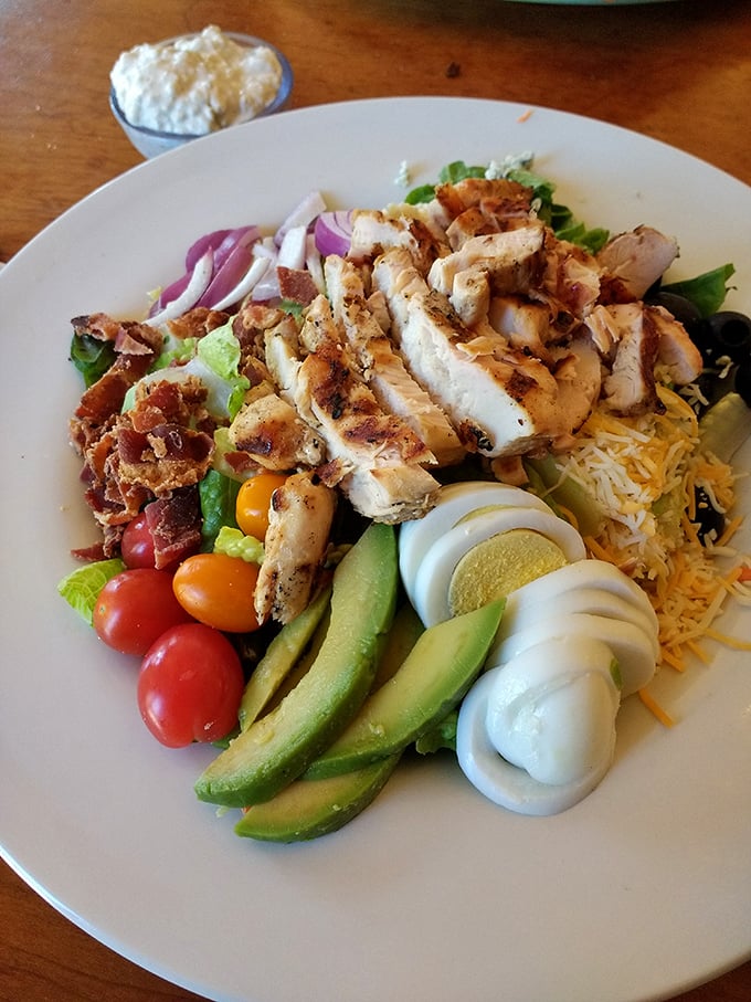 Behold the legendary Cobb salad in all its glory—a masterpiece of precision where every ingredient gets its moment in the spotlight.