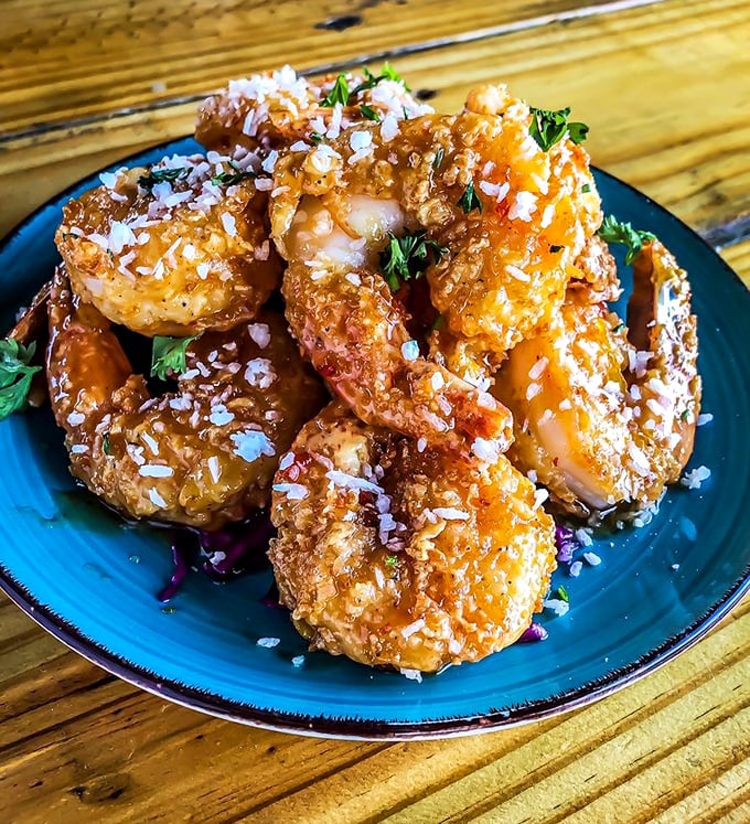 These coconut shrimp aren't just fried, they're transformed – like they went on vacation and came back with a tropical tan and stories to tell.