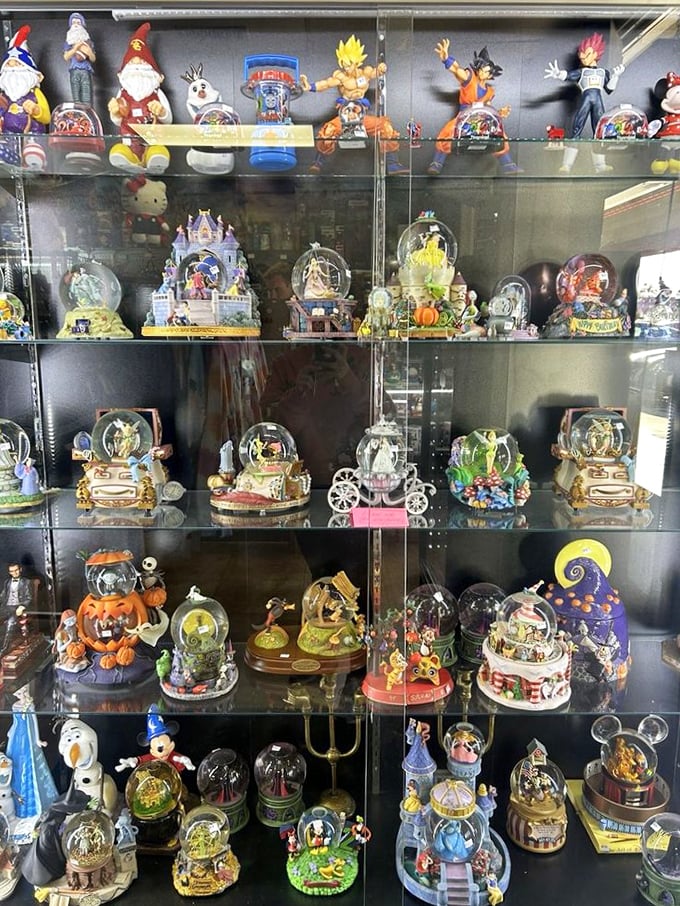 A treasure trove of Disney snow globes and figurines – each one a tiny universe of nostalgia waiting to be shaken.