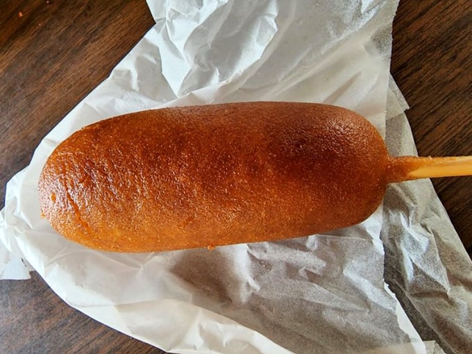The golden-brown corn dog that launched a thousand cravings – perfectly fried, with that ideal ratio of crispy cornmeal batter to juicy hot dog.