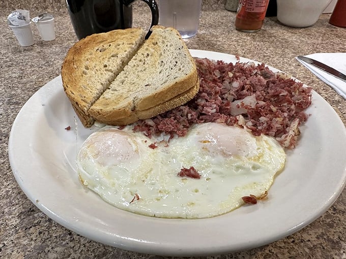 Behold the star attraction: real corned beef hash with perfectly cooked eggs. This plate doesn't need Instagram filters to look this good.