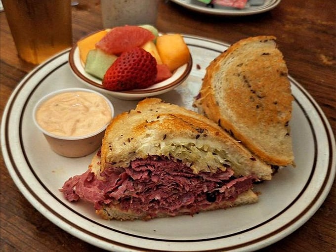 The star of the show: a perfect corned beef sandwich with just the right balance of meat, mustard, and rye bread—a holy trinity of deli perfection.