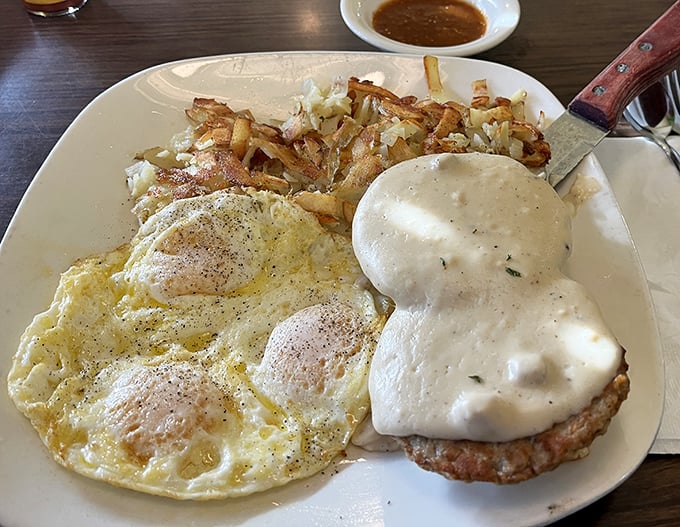 Behold the star attraction: country fried steak smothered in peppery gravy alongside perfectly cooked eggs and crispy home fries.