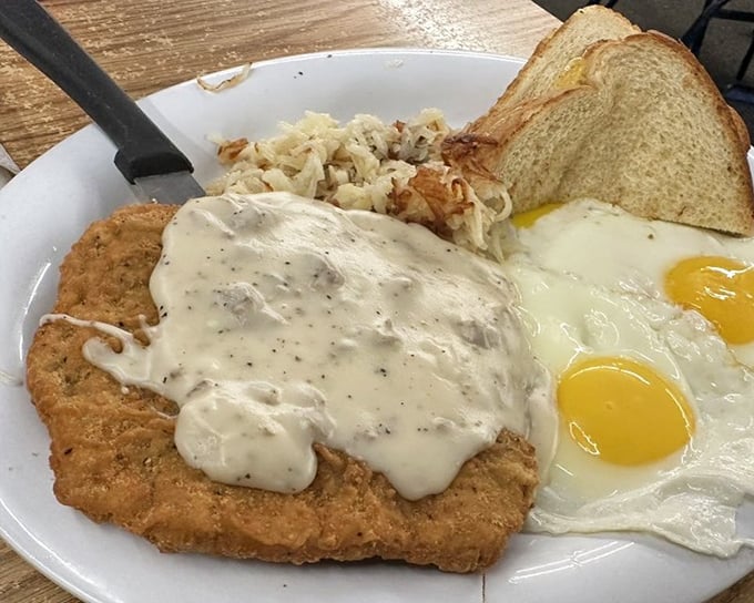 The star of the show: country fried steak smothered in pepper gravy with sunny-side-up eggs. Breakfast nirvana exists, and it comes with hash browns.