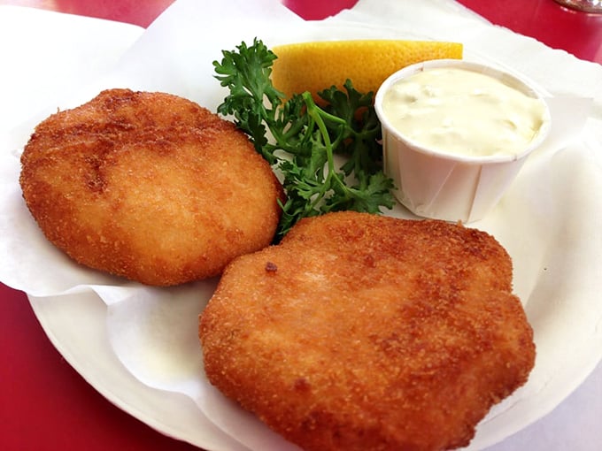 Golden-brown perfection that would make Neptune himself swim ashore. These crab cakes deliver what so many others merely promise – actual crab, gloriously unobscured by filler.