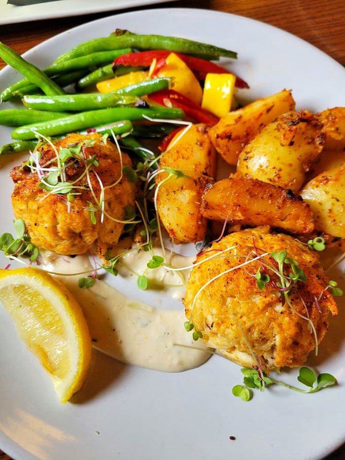 Golden-brown crab cakes that make that perfect crackling sound when your fork breaks through—like stepping on autumn leaves, but infinitely more delicious. 