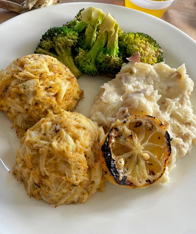Behold, the holy grail of Maryland cuisine – jumbo lump crab cakes with minimal filler and maximum flavor, served with a side of "why can't all crab cakes be this good?"