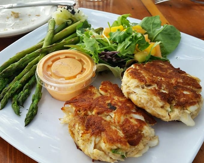 Golden-brown crab cakes that are all meat, no filler—the way nature intended. Served with asparagus that actually makes you want to eat your vegetables. 