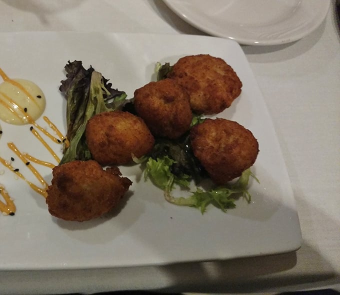 These golden-brown crab cake bites aren't just appetizers—they're edible ambassadors of the sea, perfectly portioned for maximum enjoyment.
