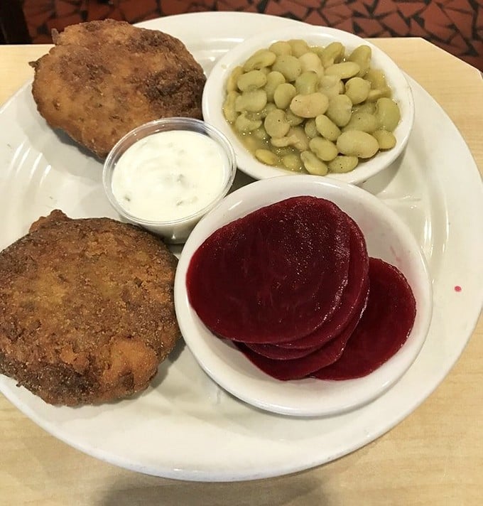 These crab cakes aren't playing games – just pure, lump crab meat with minimal filler, served alongside lima beans and beets for a Southern touch.