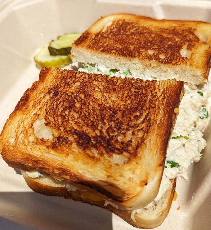 The legendary crab sandwich in all its glory – perfectly toasted bread cradling sweet, fresh Dungeness meat. Simplicity that speaks volumes.